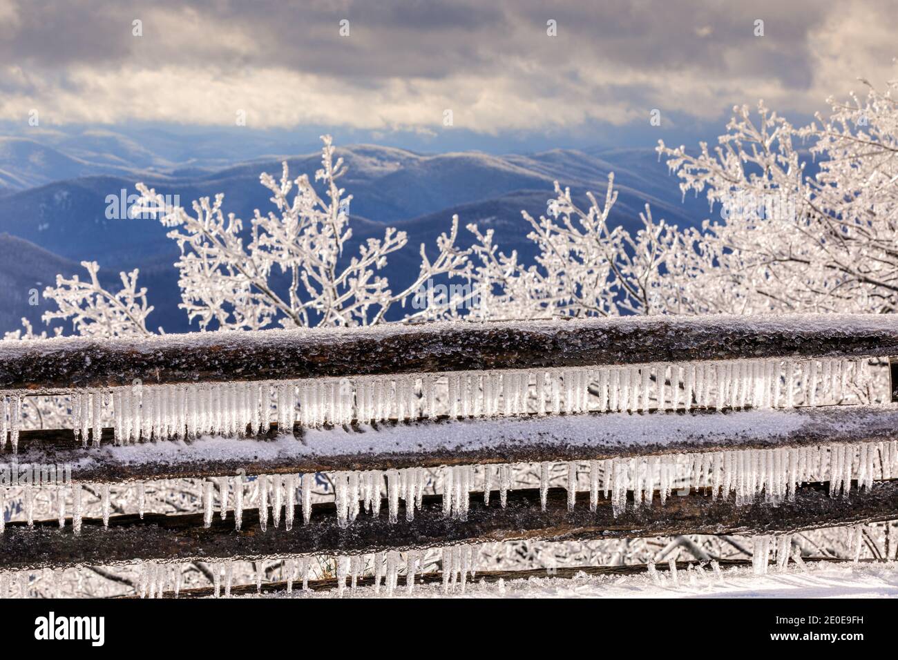 Devil's Knob Overlook - Icicles hanging from split rail fence with ...