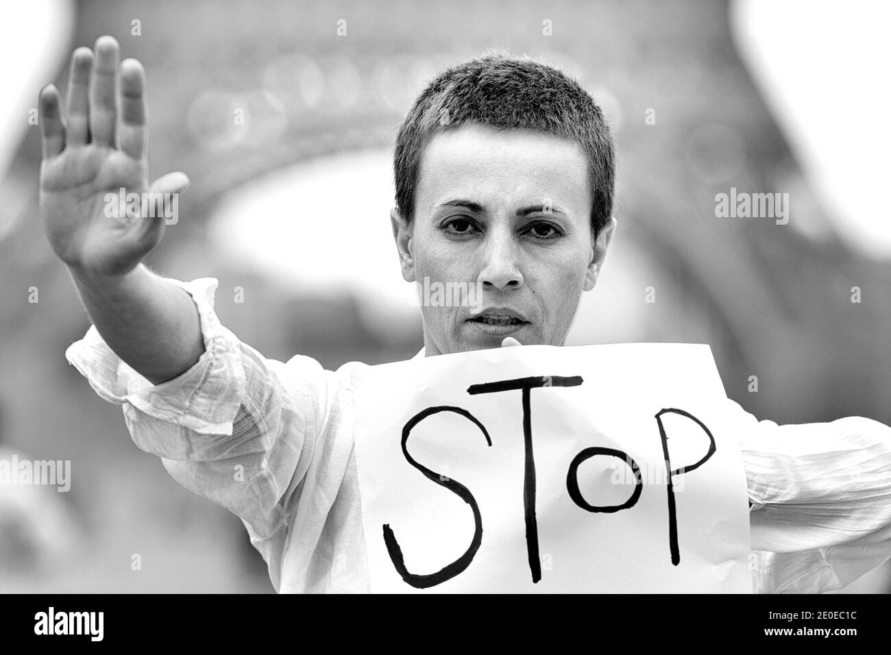 Syrian actress Fadwa Sulaiman, poses with a "STOP" sign, as a way to ...