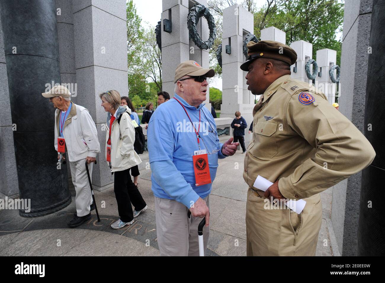 North Carolina WWII veteran Charles Dougherty(L) talks to John ...