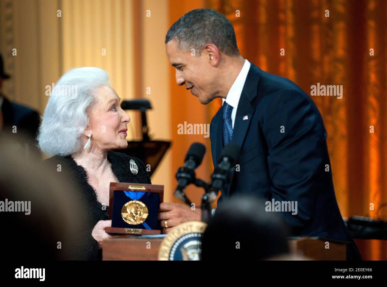 US President Barack Obama presents Eunice David, the wife of musician ...