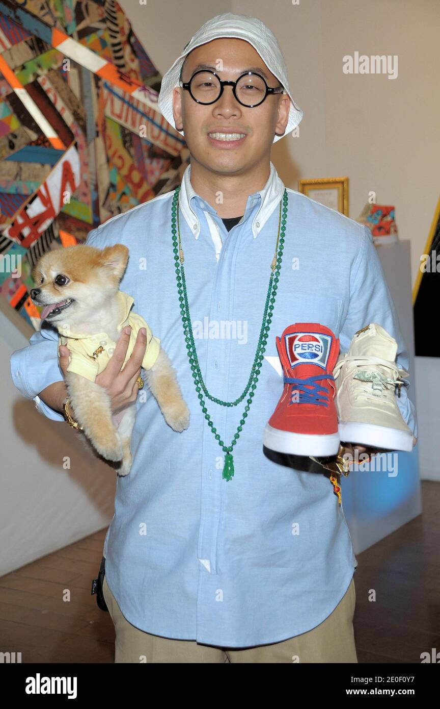 Kevin Leong and dog Change attending the Project Canvas exhibition and ...
