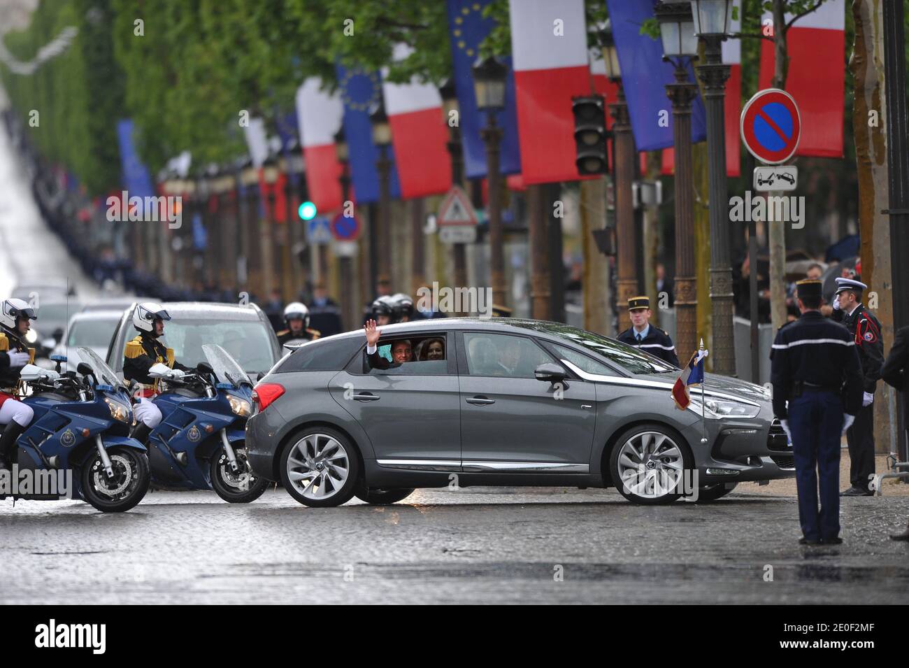France's President Francois Hollande parades in a car (a Citroen DS5 ...