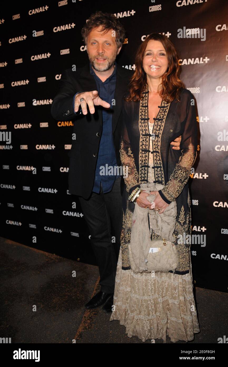 Stephane Guillon and his wife arriving at the Canal Plus Party at the ...