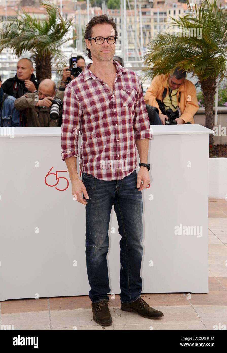 Guy Pearce posing at Lawless photocall held at the Palais Des Festivals ...