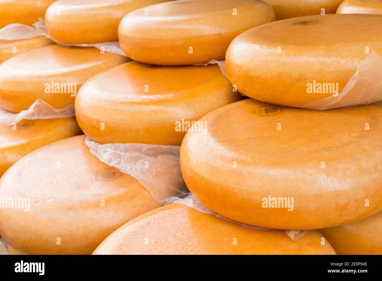 Wheels of Gouda Cheese stacked in a wagon after the market Stock Photo ...