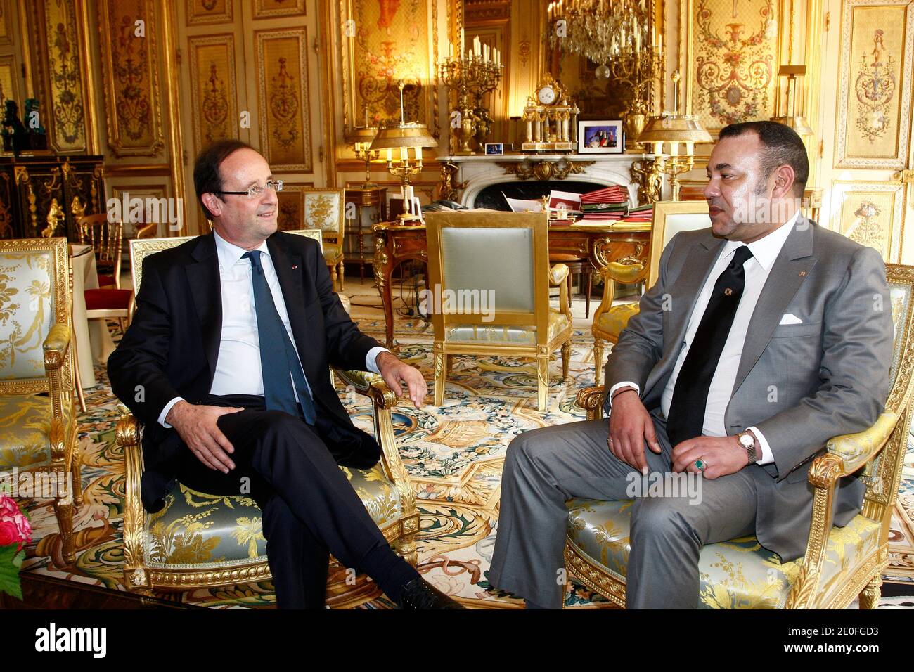 French President Francois Hollande speaks with Morocco's King Mohamed ...