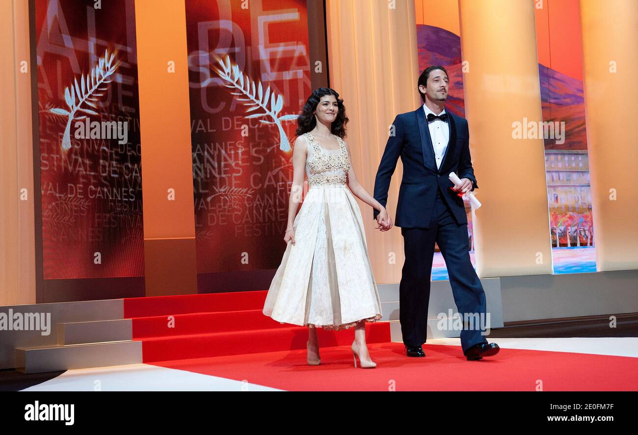 Actors Audrey Tautou and Adrien Brody speak on stage at the Closing ...
