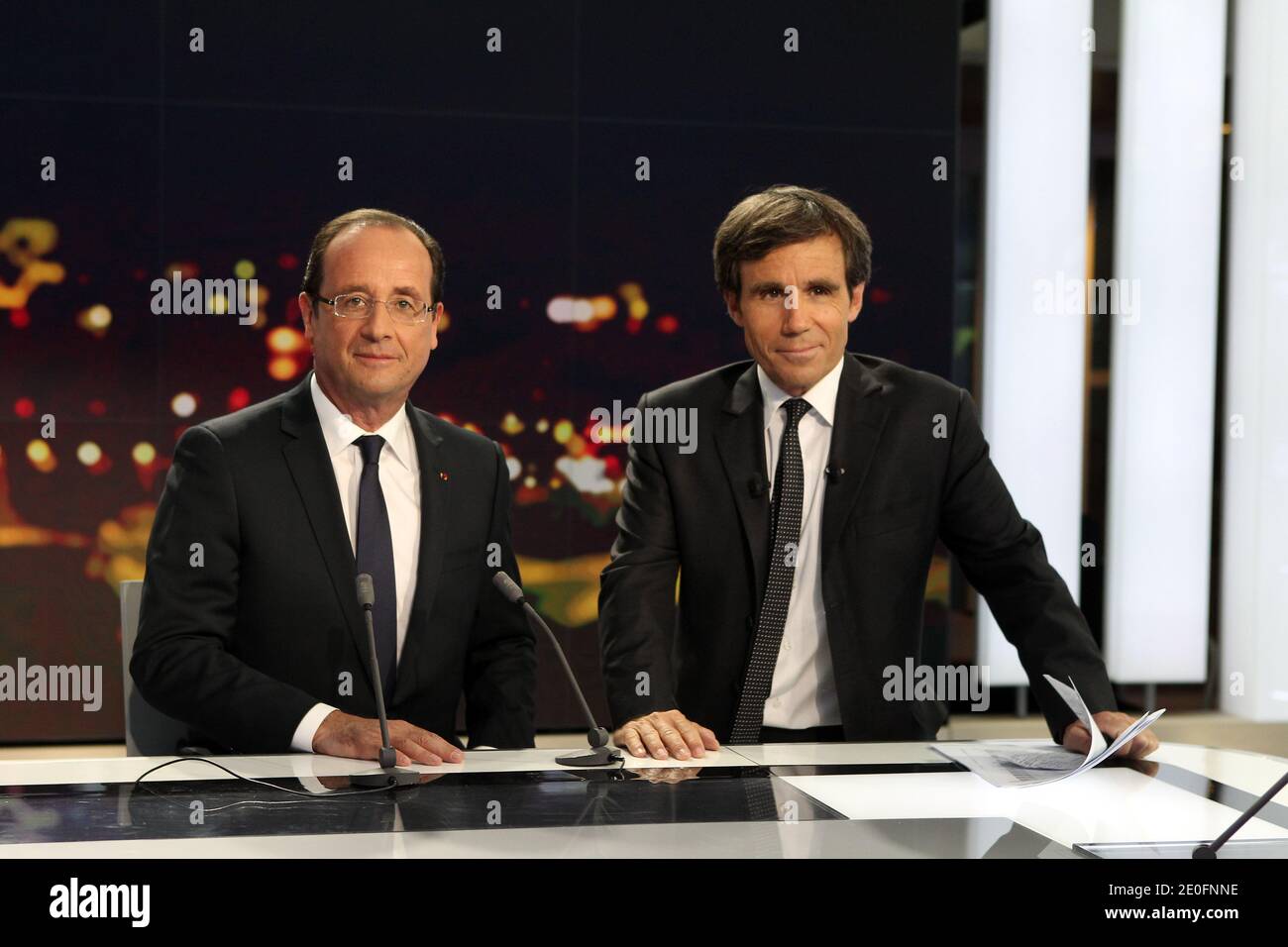 French President Francois Hollande gets ready to be interviewed by ...