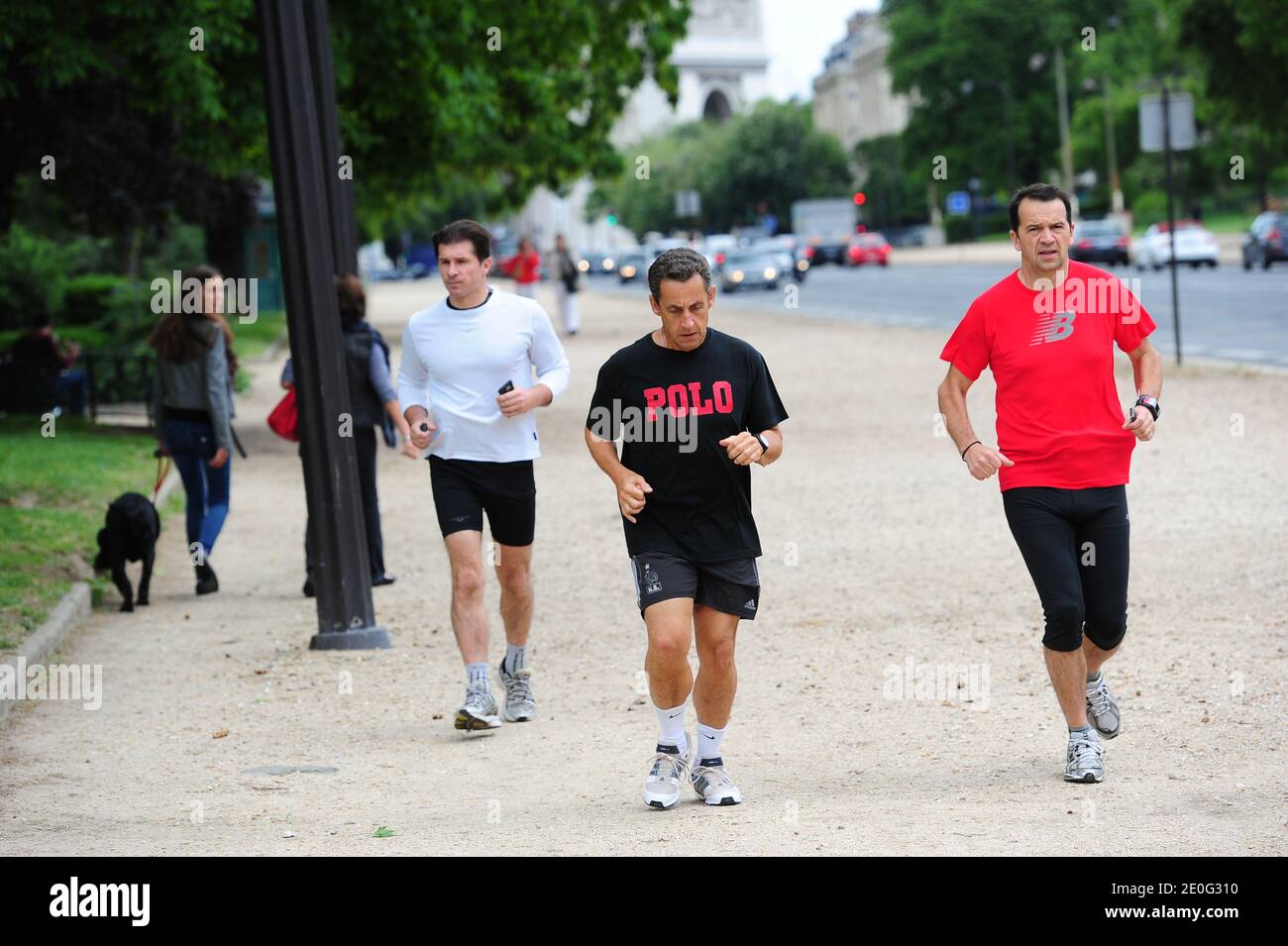 Former French President Nicolas Sarkozy jogging on Avenue Foch in Paris ...