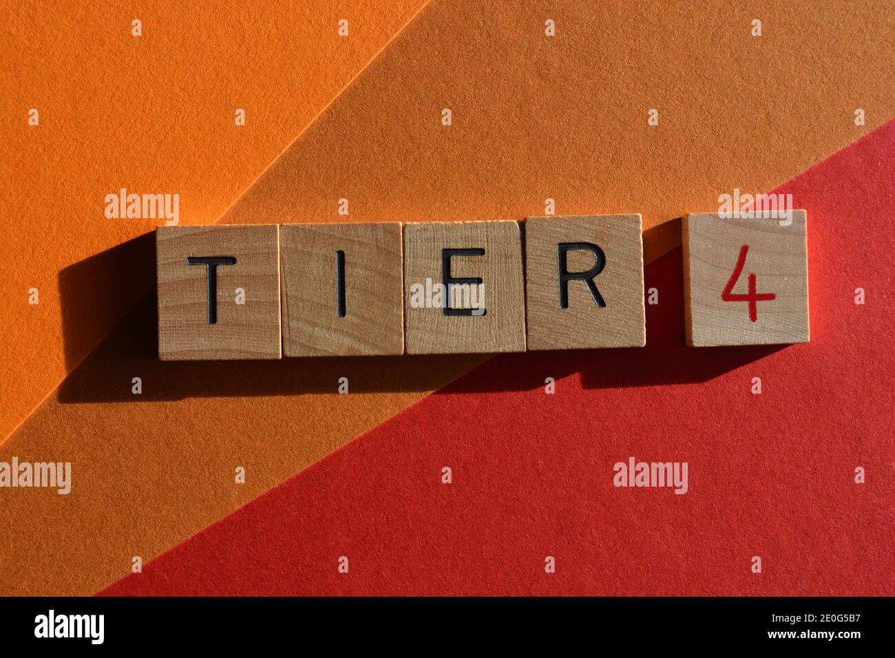 Tier 4, coronavirus alert levels, word in wooden alphabet letters ...