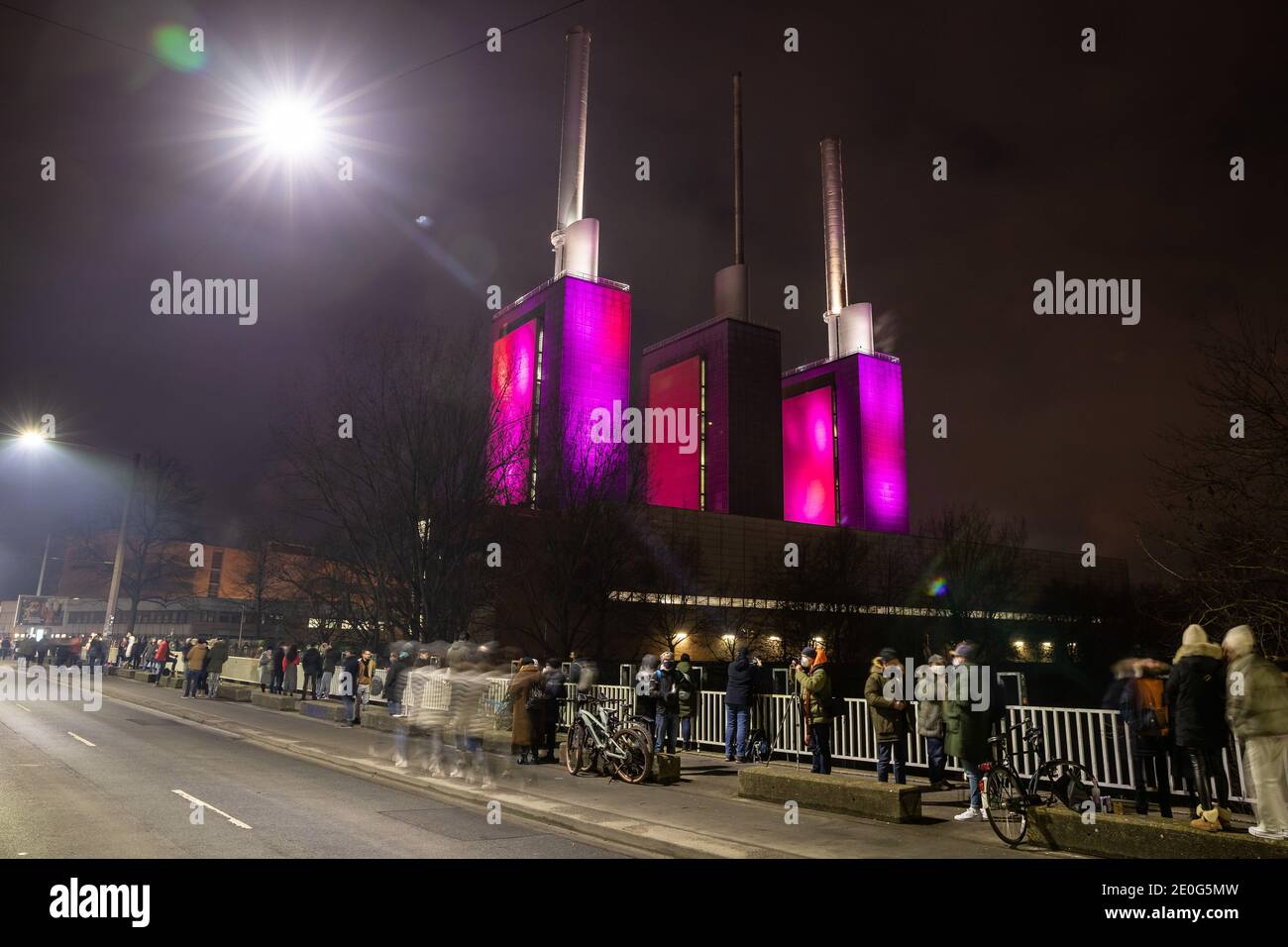Hanover, Germany. 01st Jan, 2021. People watch a light show ...