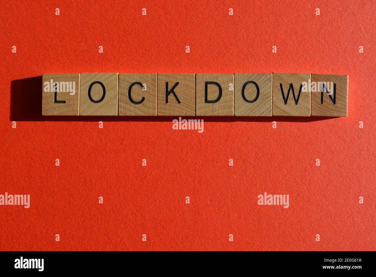 Lockdown, word in wooden alphabet letters isolated on red background ...