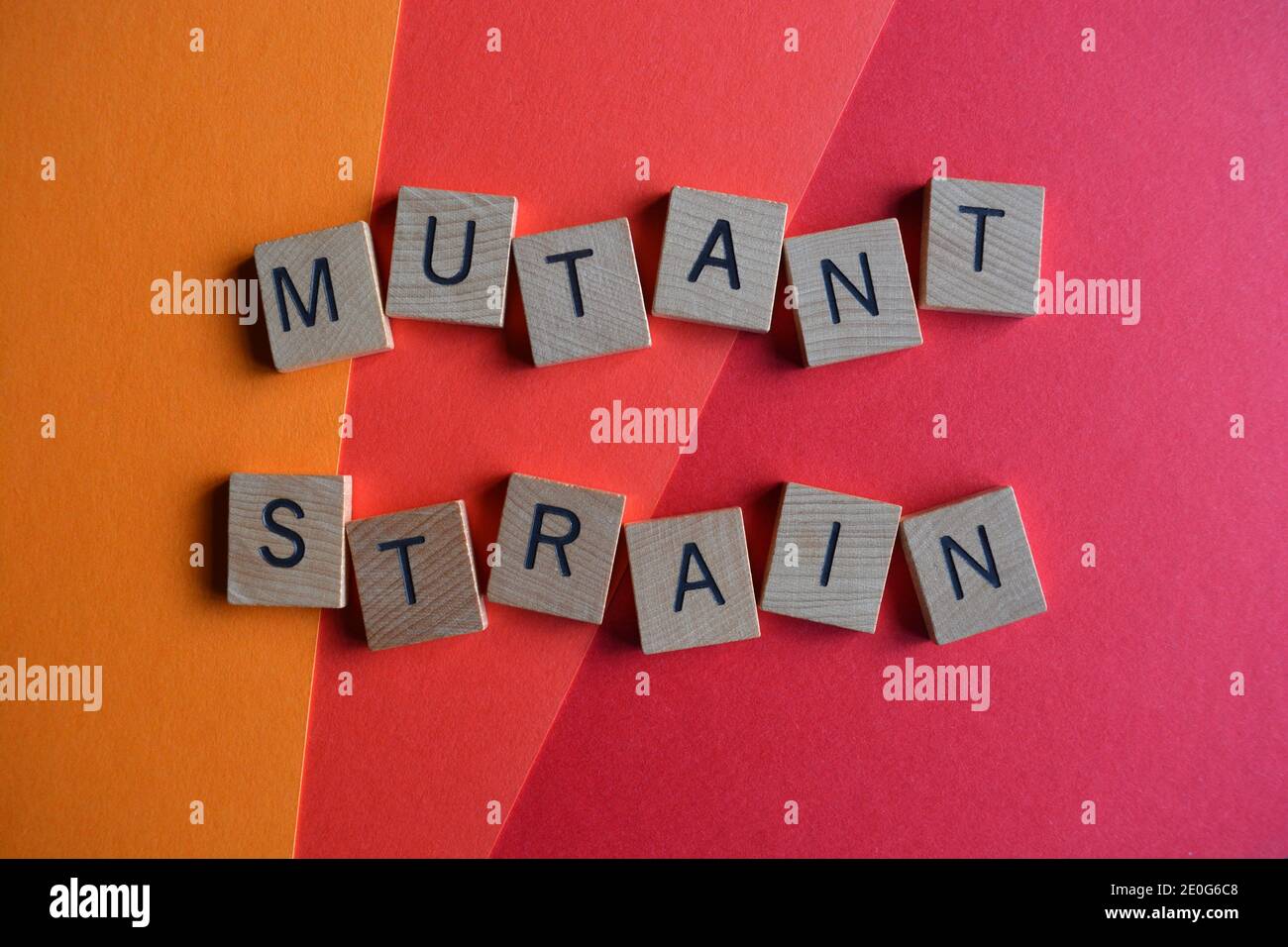 Mutant Strain, words in wooden alphabet letters on red background Stock ...