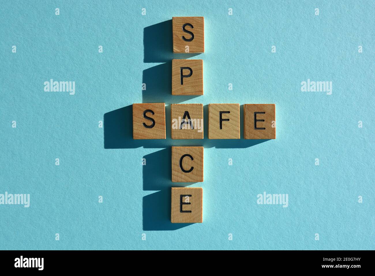 Safe, Space, words in wooden alphabet letters isolated on blue ...