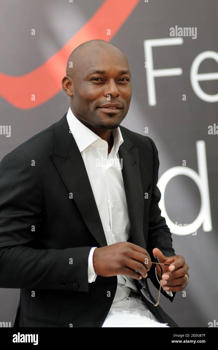 Jimmy Jean-Louis posing at a photocall for the TV show 'Toussaint ...