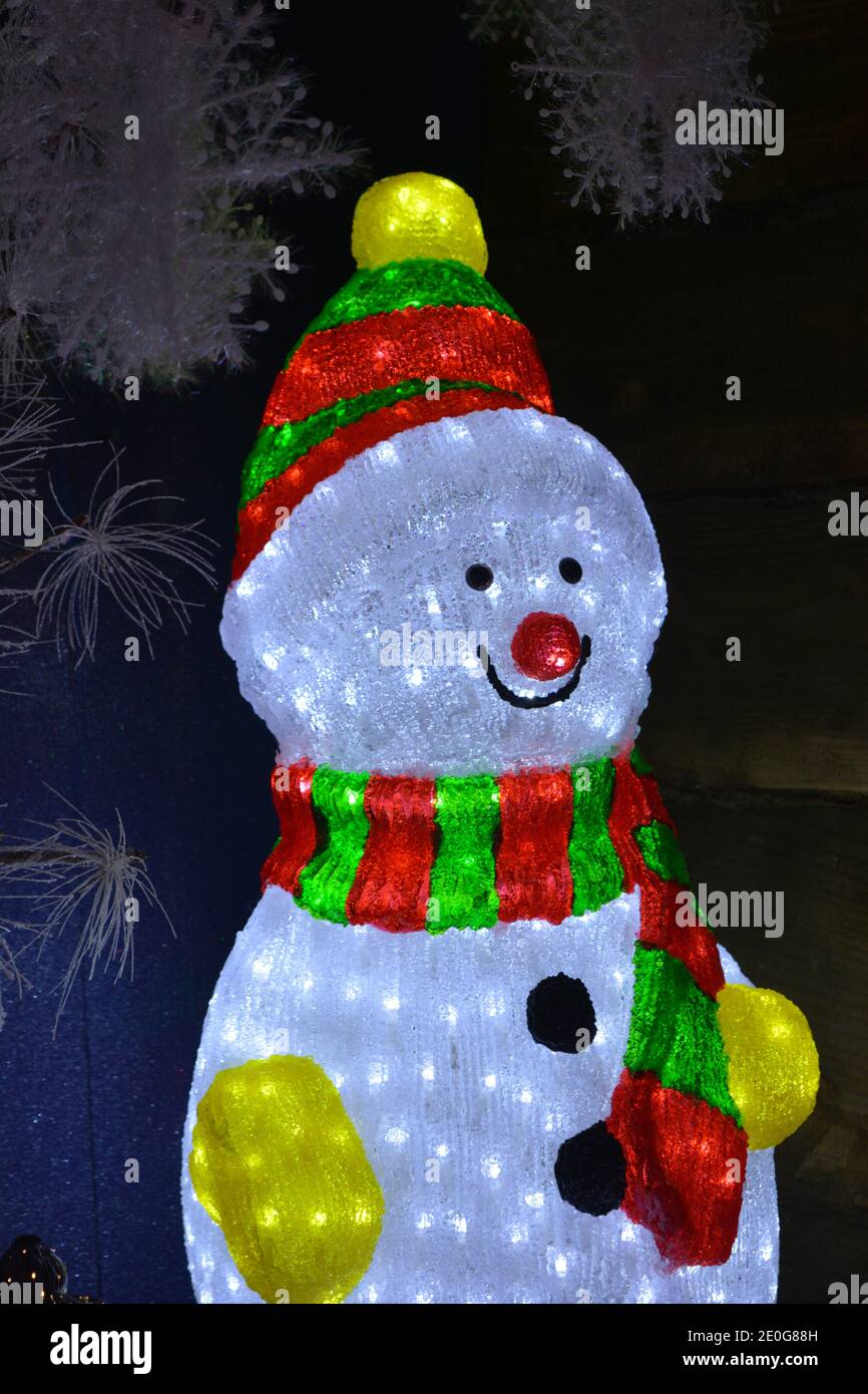 Christmas decorations, festive illuminated snowman Stock Photo - Alamy