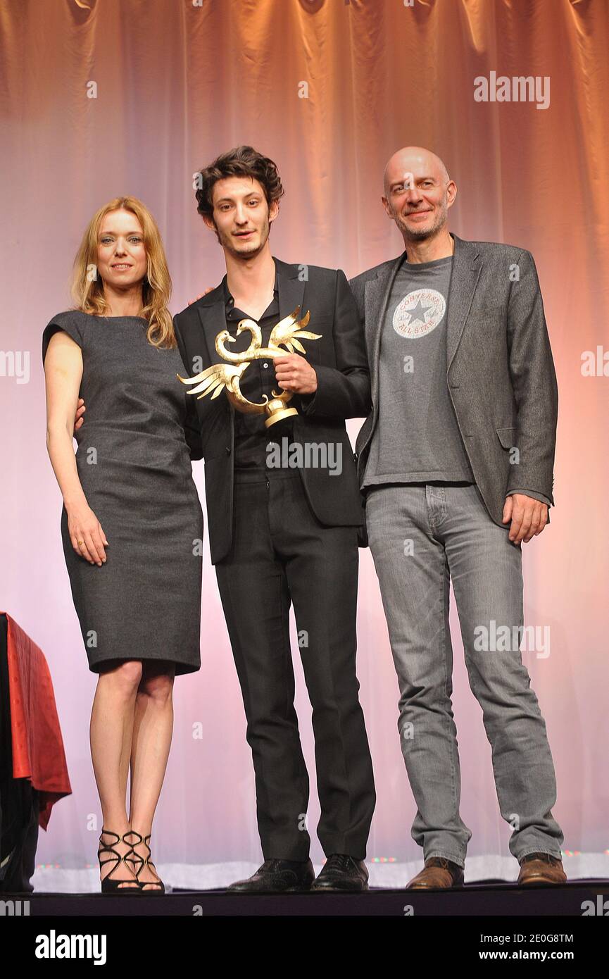 Lea Drucker poses with Pierre Niney during a ceremony after he received ...
