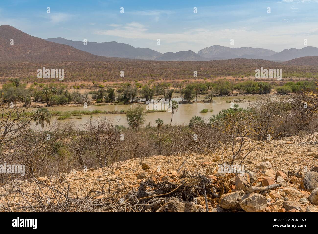 Landscape view of the Kunene River, the border river between Namibia ...