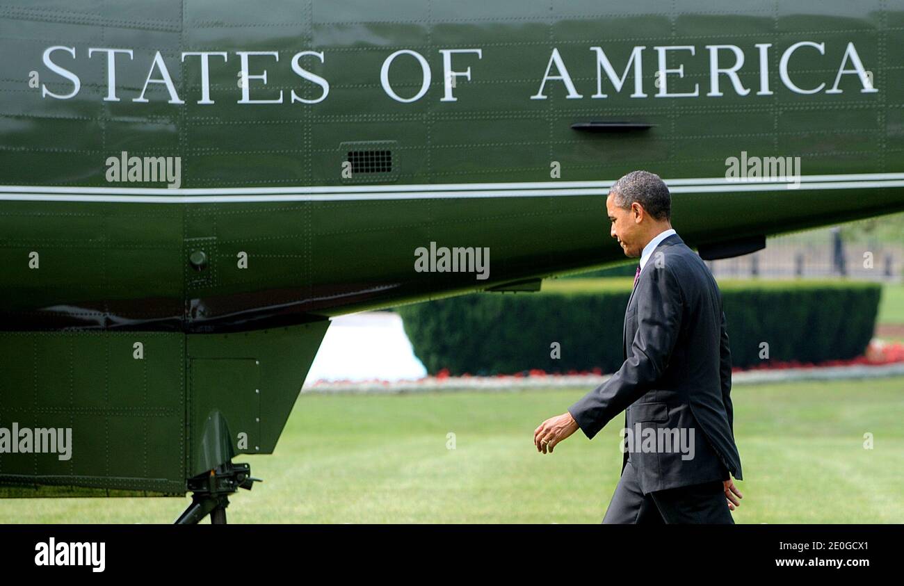 US President Barack Obama walks on the South Lawn as he departs the ...