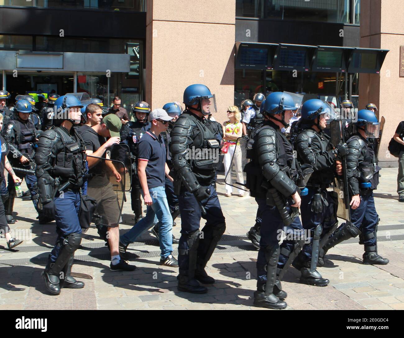 Anti-riot forces detain protestors during a forbidden demonstration of ...