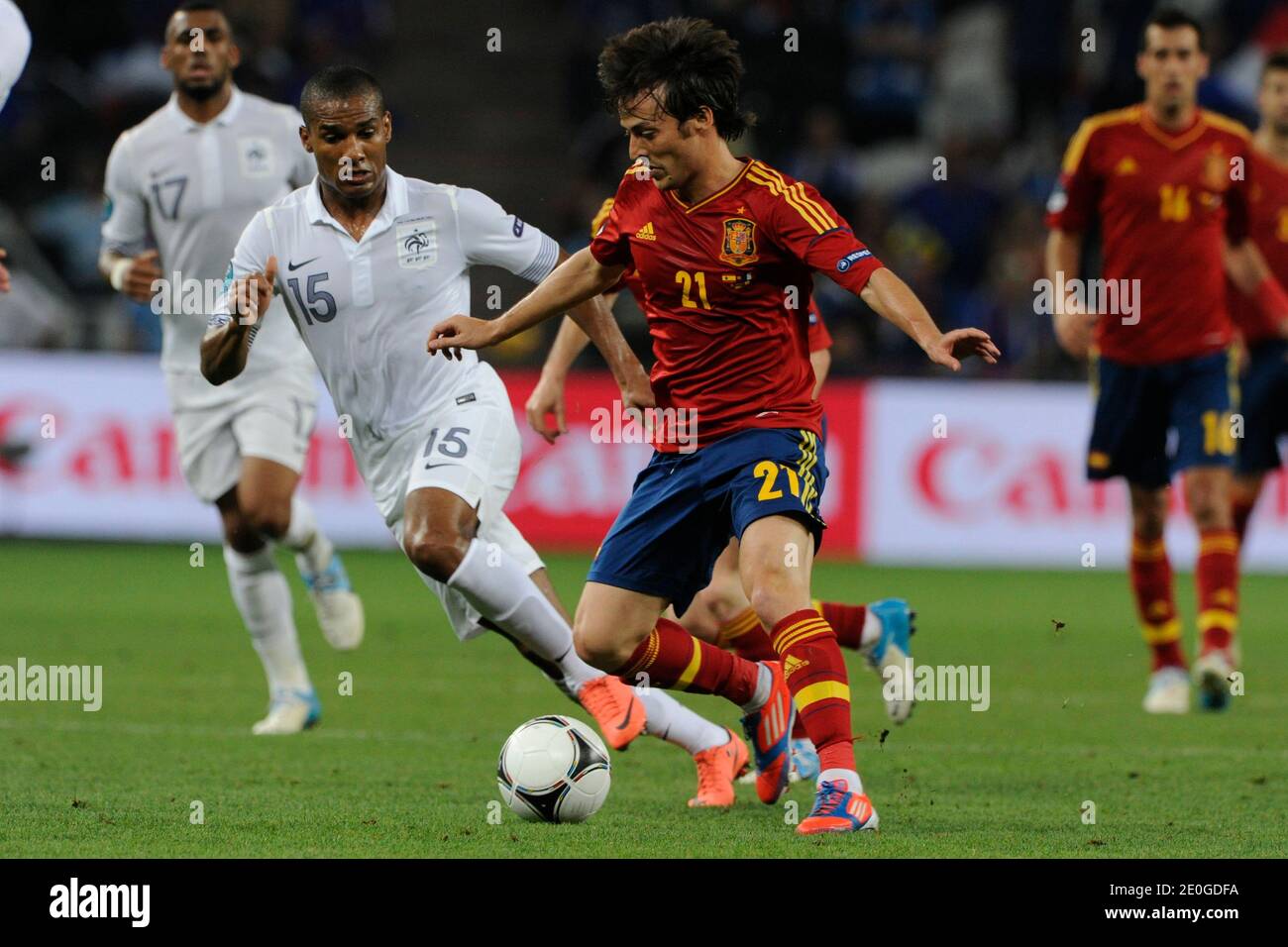 France's Florent Malouda battles Spain's David Silva during the Euro ...