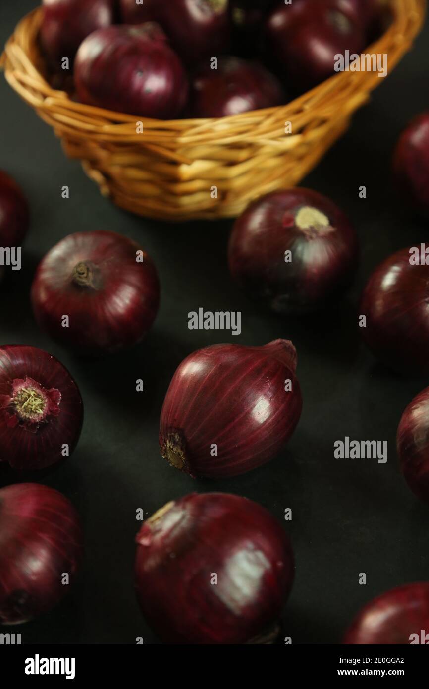 sweet red onions on background Stock Photo - Alamy