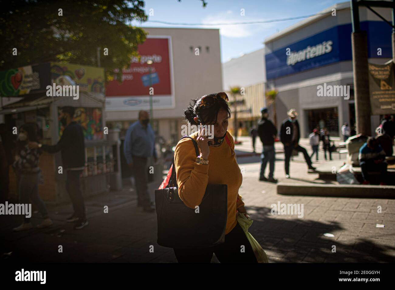 HERMOSILLO, MEXICO DECEMBER 31: People walk the streets of downtown for ...