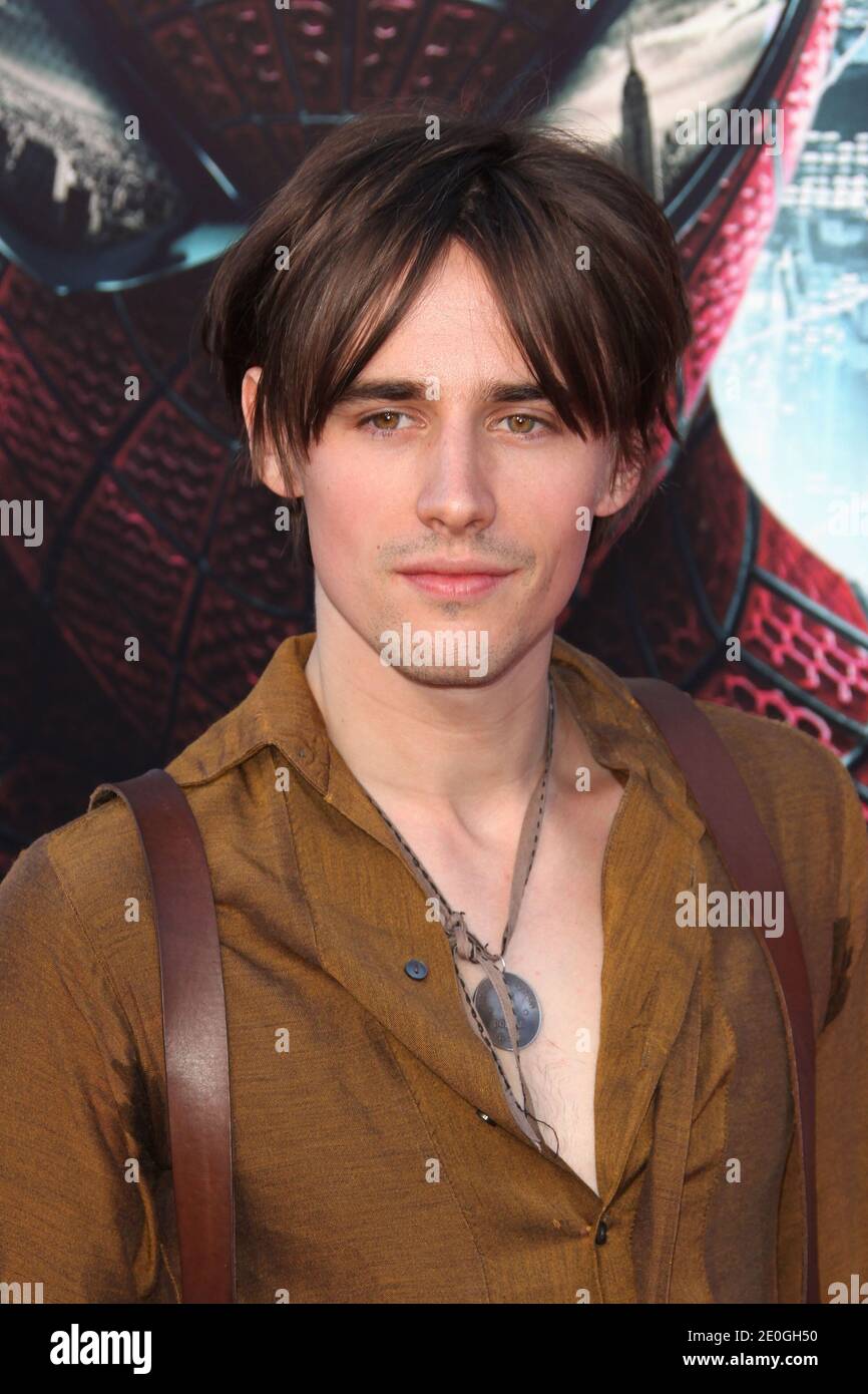 Reeve Carney arriving at the premiere of Columbia Pictures 'The Amazing ...