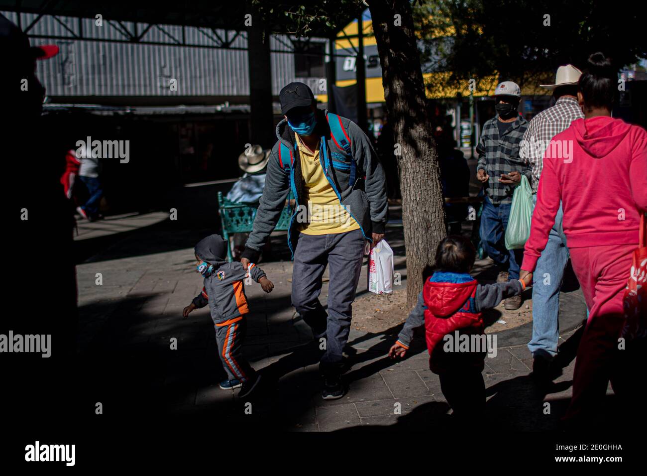 HERMOSILLO, MEXICO DECEMBER 31: People walk the streets of downtown for ...