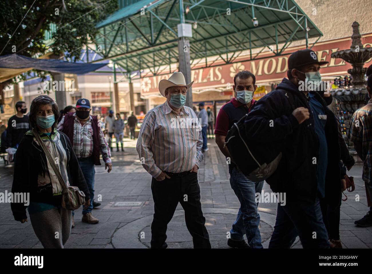 HERMOSILLO, MEXICO DECEMBER 31: People walk the streets of downtown for ...