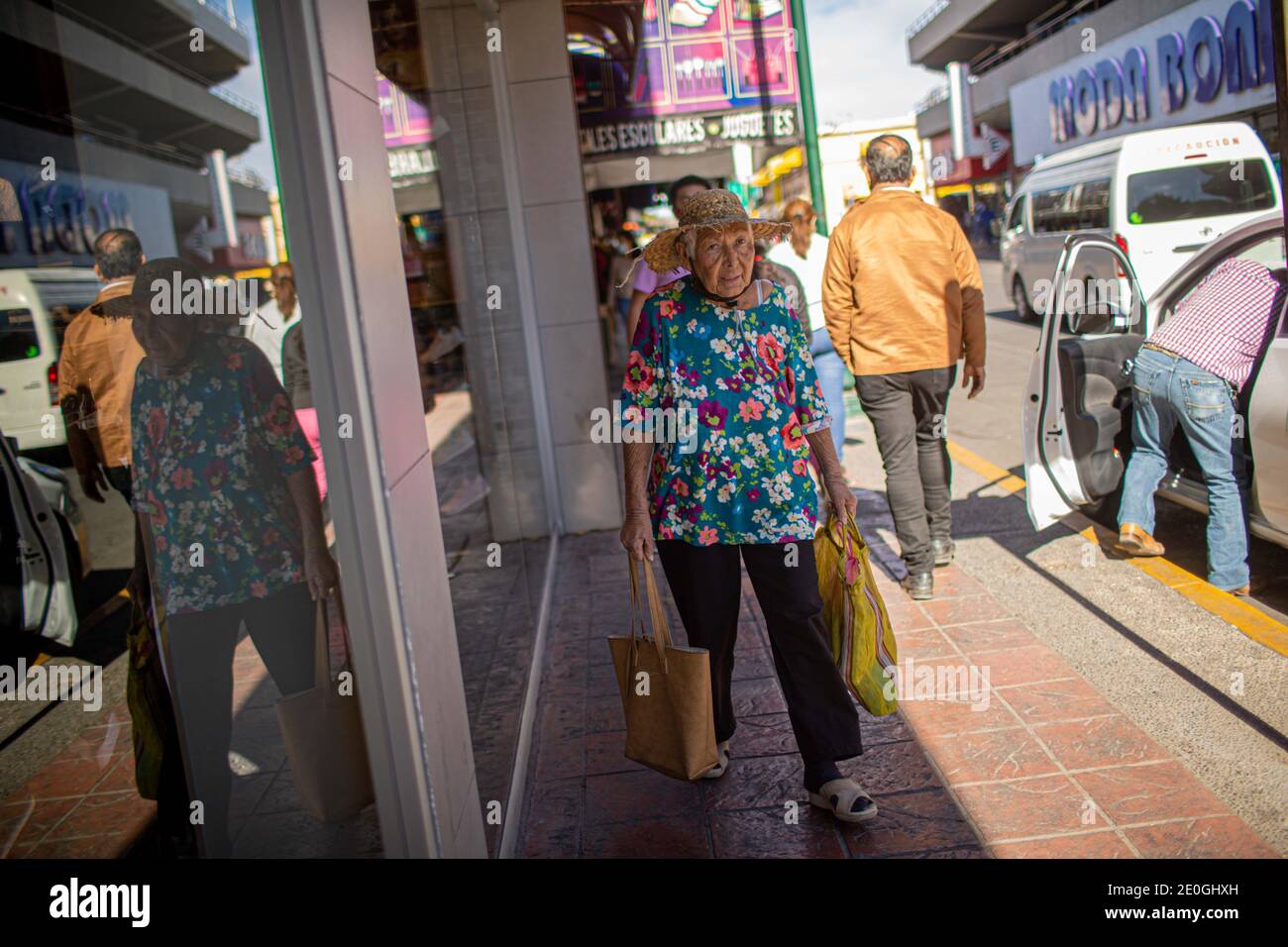 HERMOSILLO, MEXICO DECEMBER 31: People walk the streets of downtown for ...