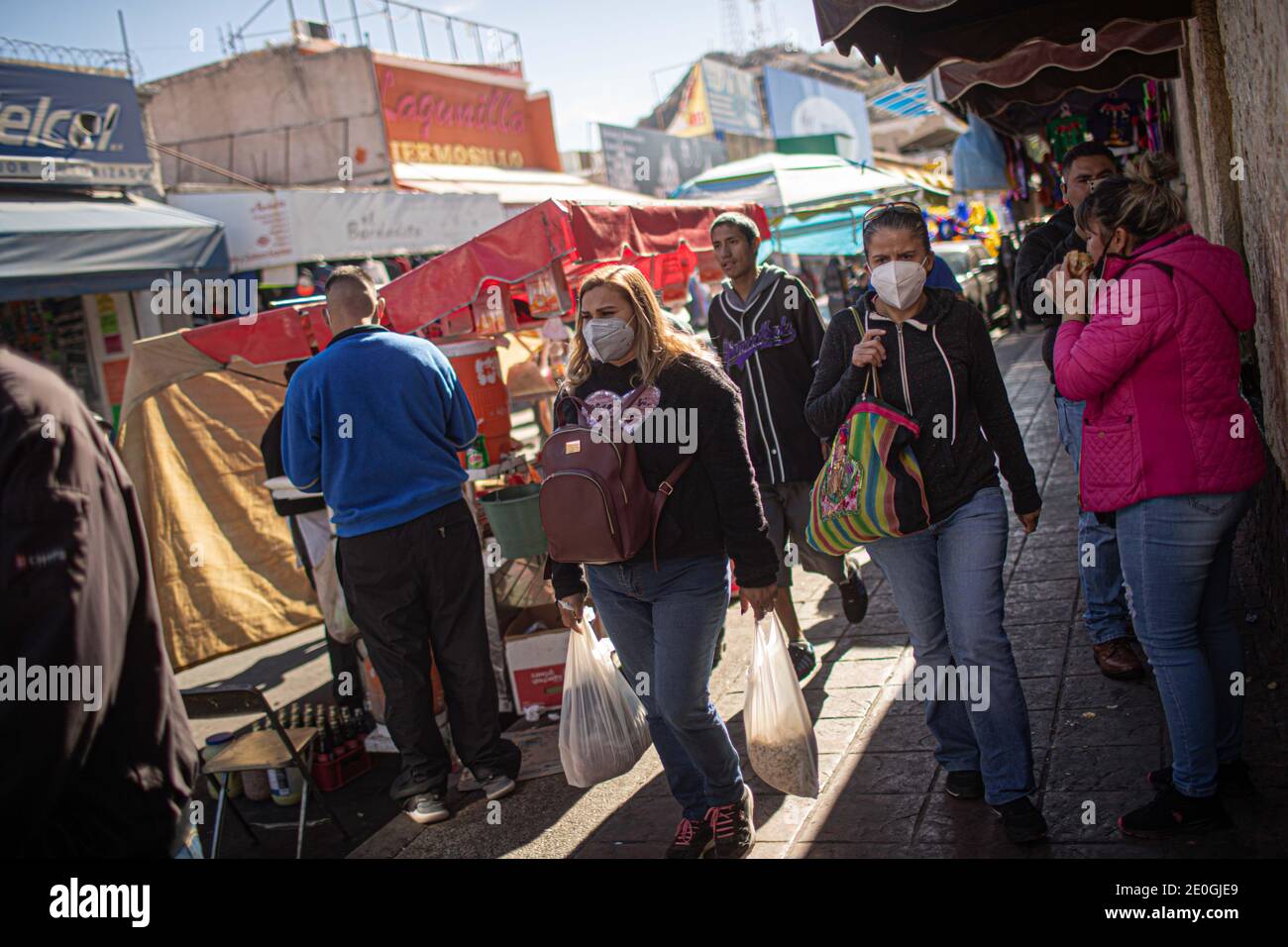 HERMOSILLO, MEXICO DECEMBER 31: People walk the streets of downtown for ...
