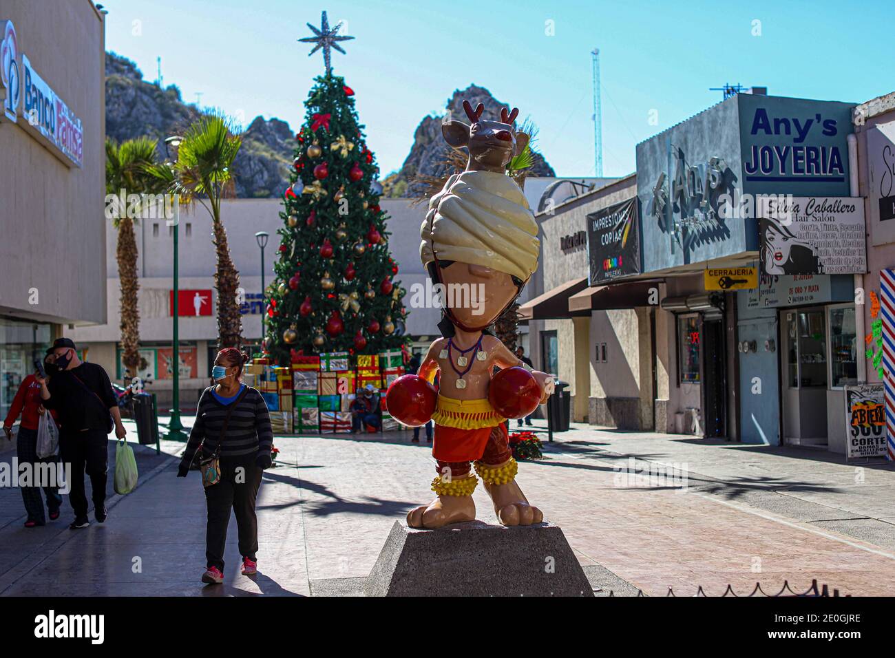 HERMOSILLO, MEXICO DECEMBER 31: People walk the streets of downtown for ...