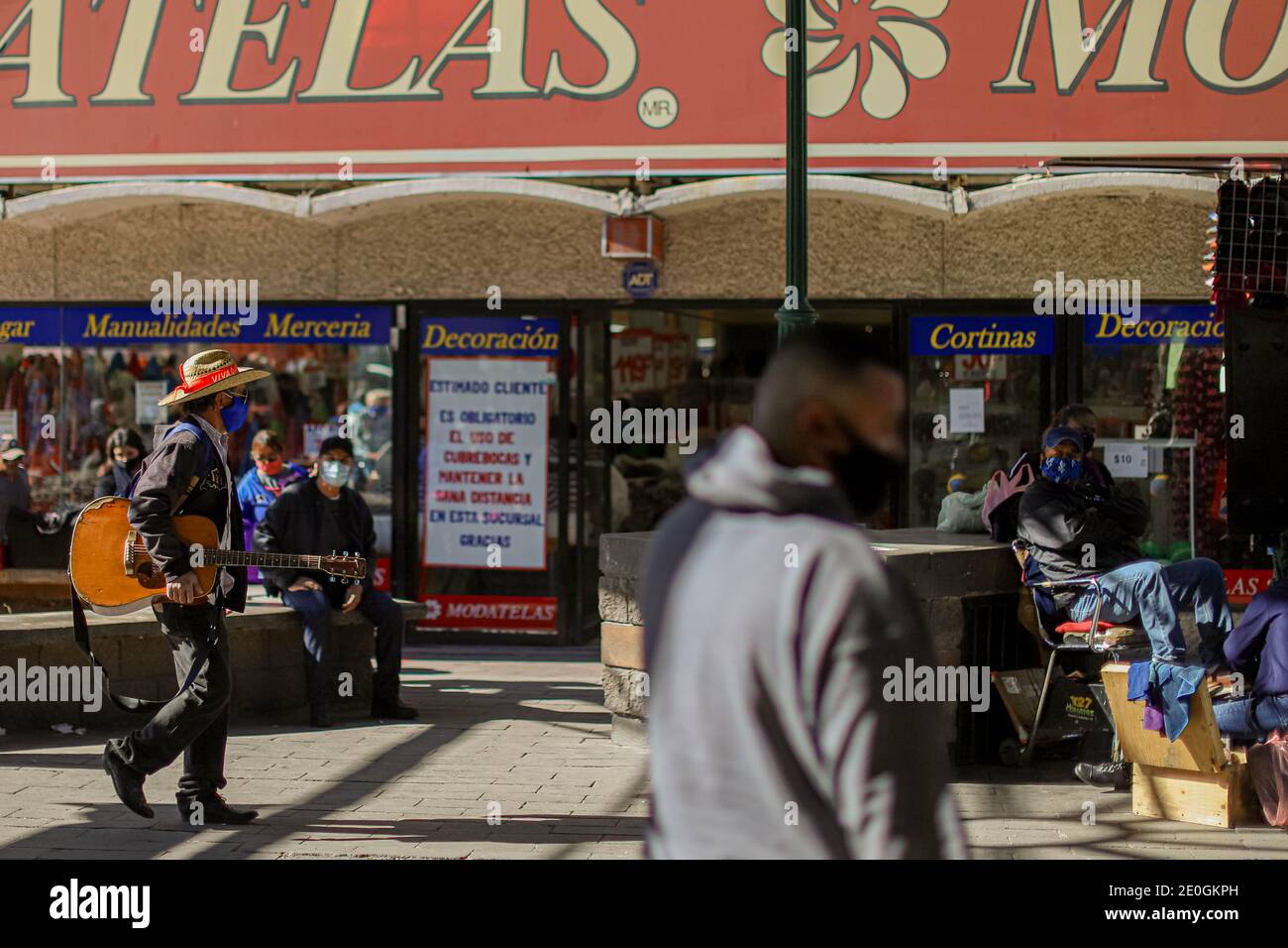 HERMOSILLO, MEXICO DECEMBER 31: People walk the streets of downtown for ...