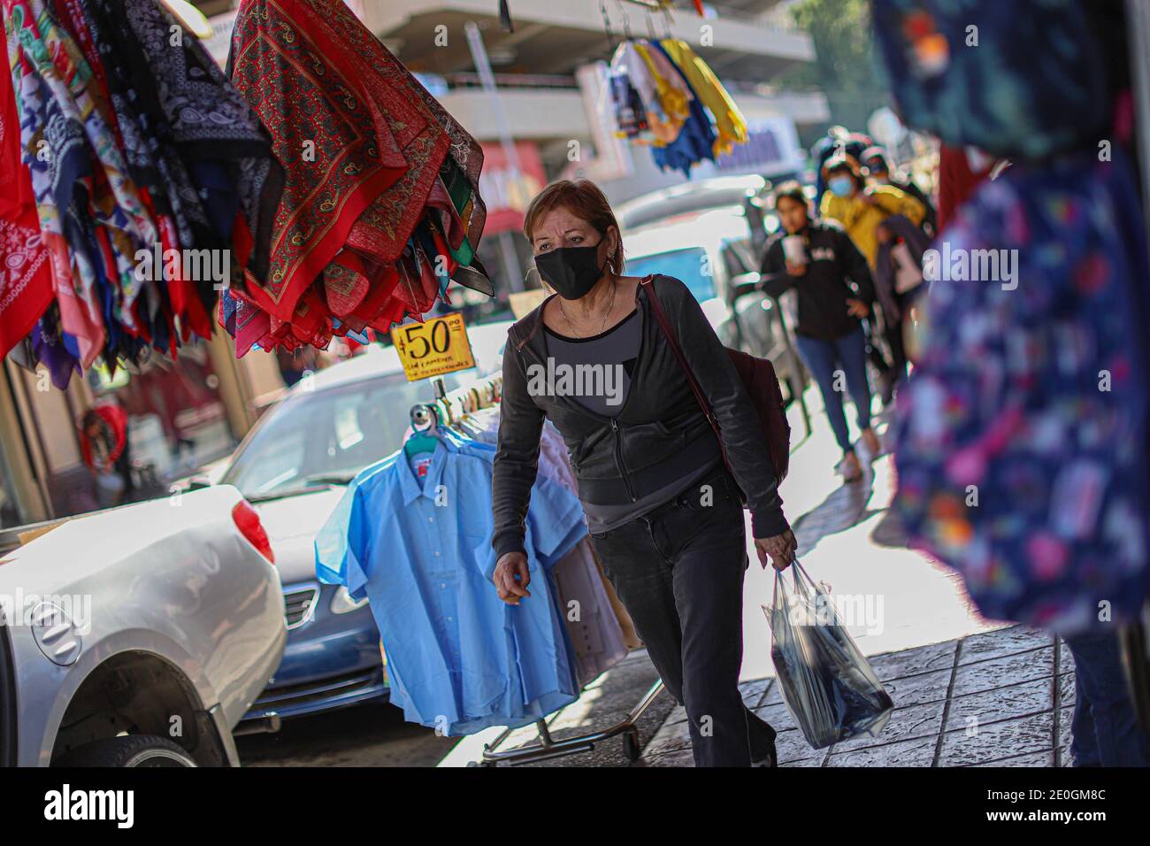 HERMOSILLO, MEXICO DECEMBER 31: People walk the streets of downtown for ...