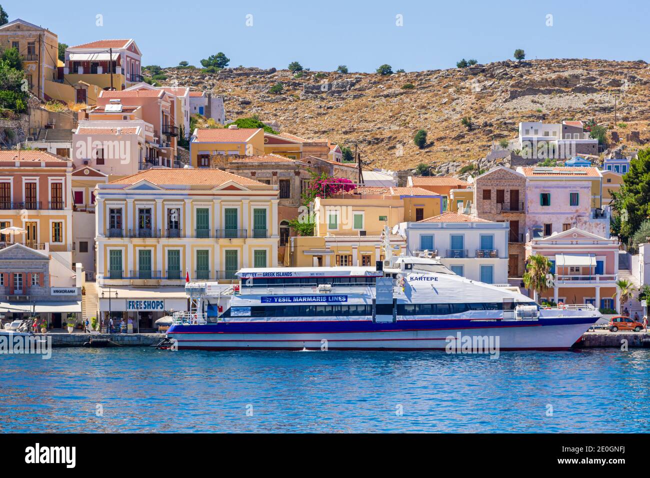 Yesil Marmaris MV Kartepe catamaran moored at the port of Gialos, Symi ...