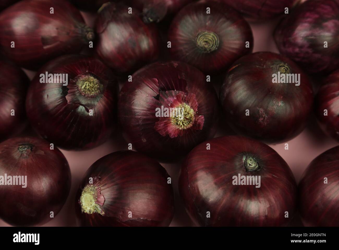 sweet red onions on background Stock Photo - Alamy