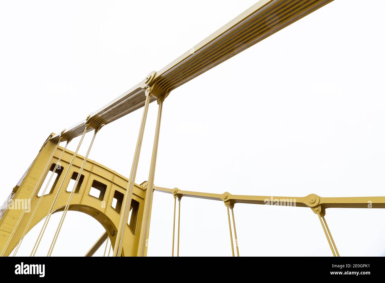 Yellow painted bridge upright and suspension supports, horizontal ...