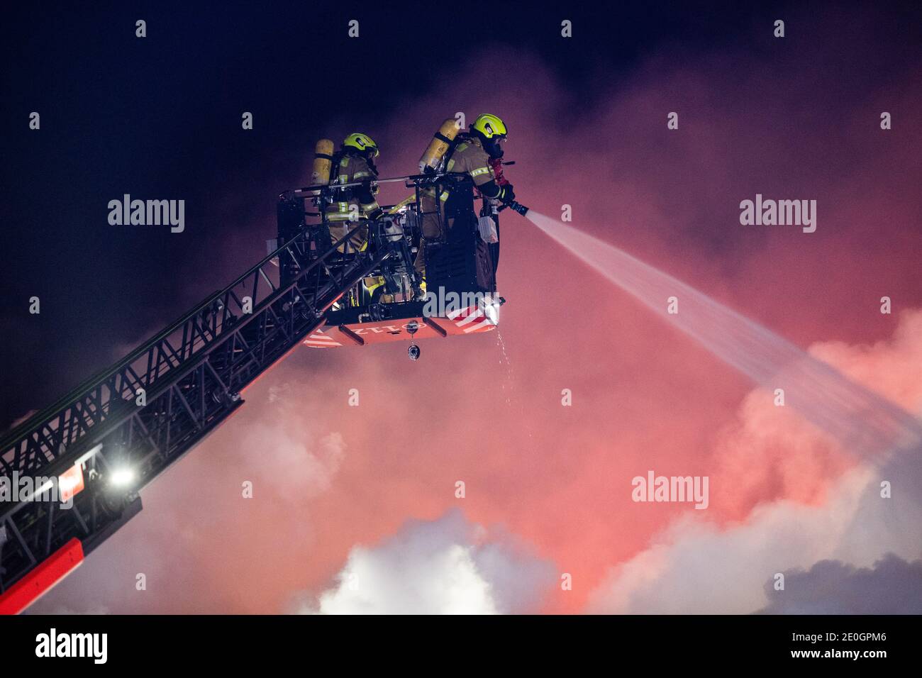 Berlin, Germany. 01st Jan, 2021. Firefighters extinguish a burning ...