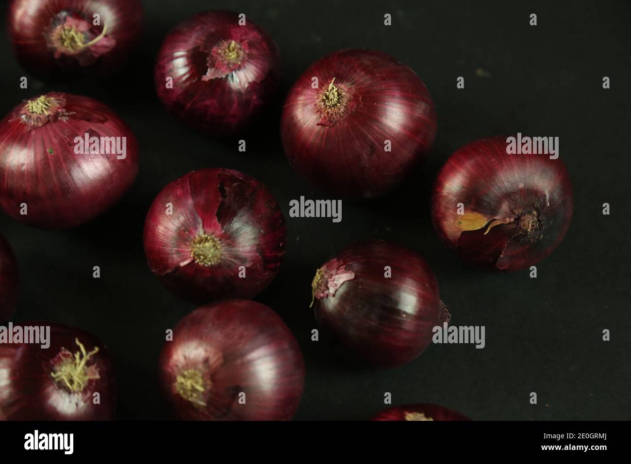 sweet red onions on background Stock Photo - Alamy