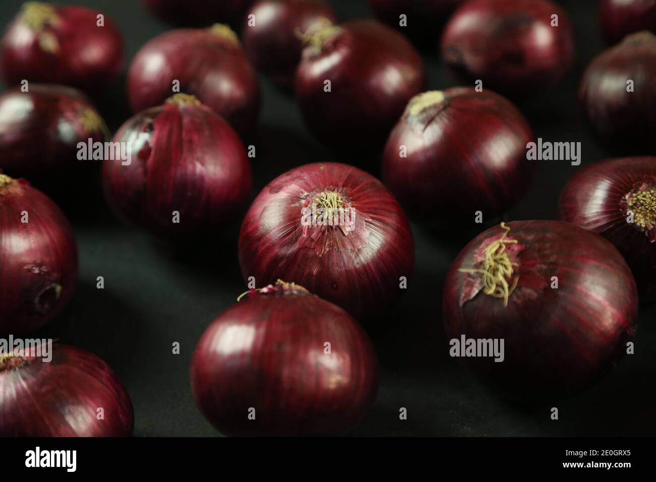 sweet red onions on background Stock Photo - Alamy