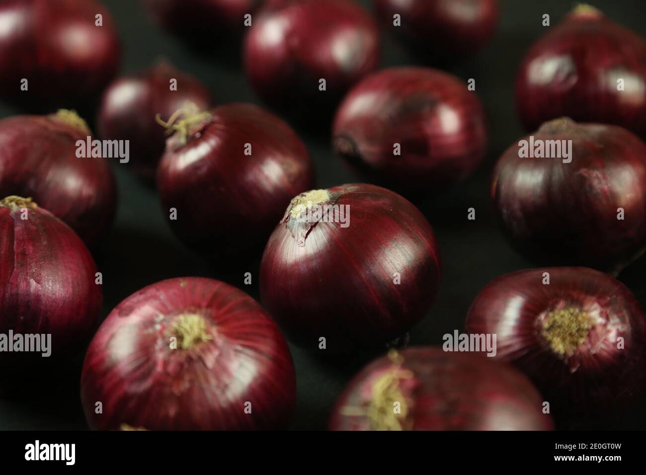 sweet red onions on background Stock Photo - Alamy