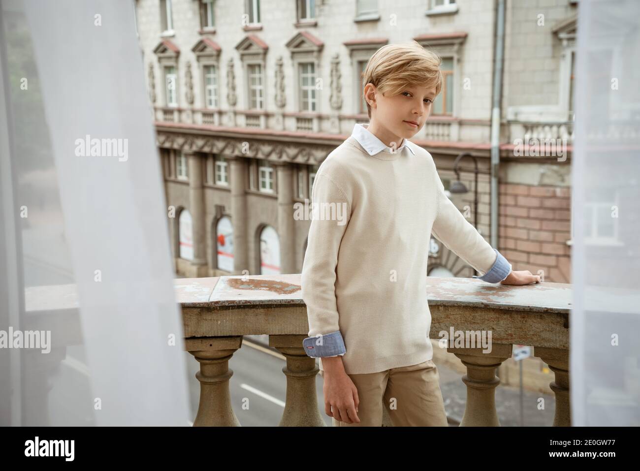 Blond Boy On Balcony High Resolution Stock Photography and Images - Alamy