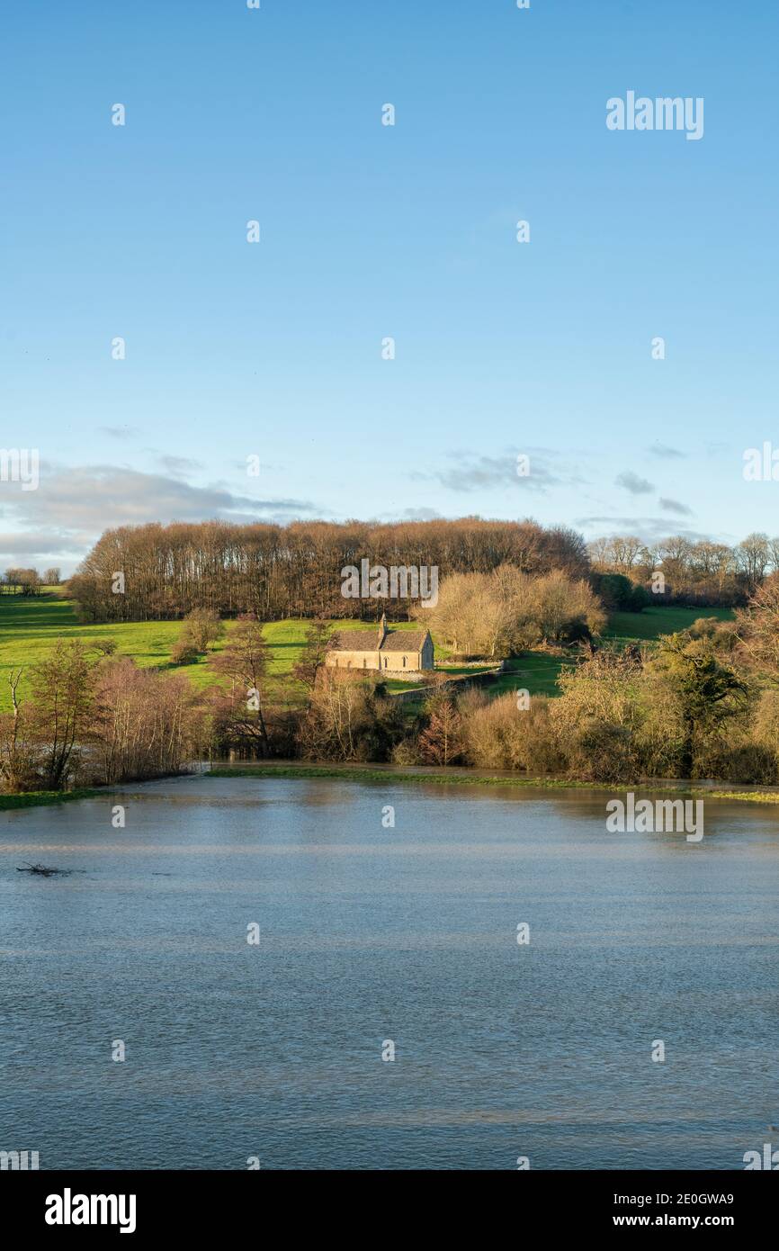 Flooded fields along the river windrush next to St Oswald's church on ...