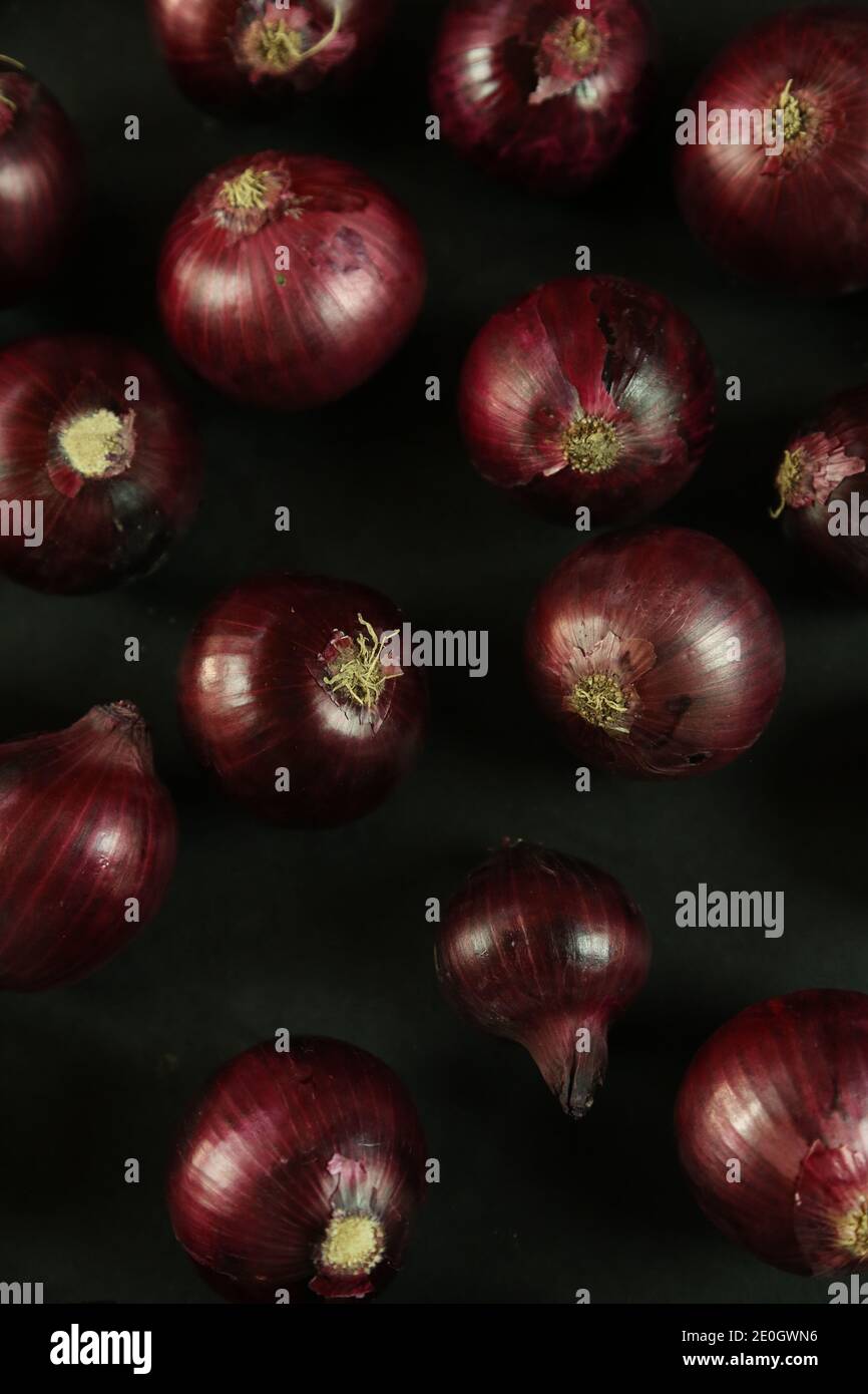 sweet red onions on background Stock Photo - Alamy
