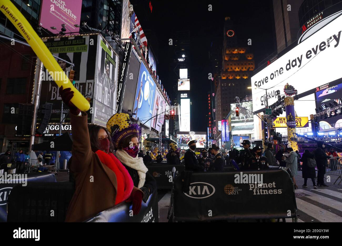 New York, United States. 31st Dec, 2020. Two revelers watch a ...