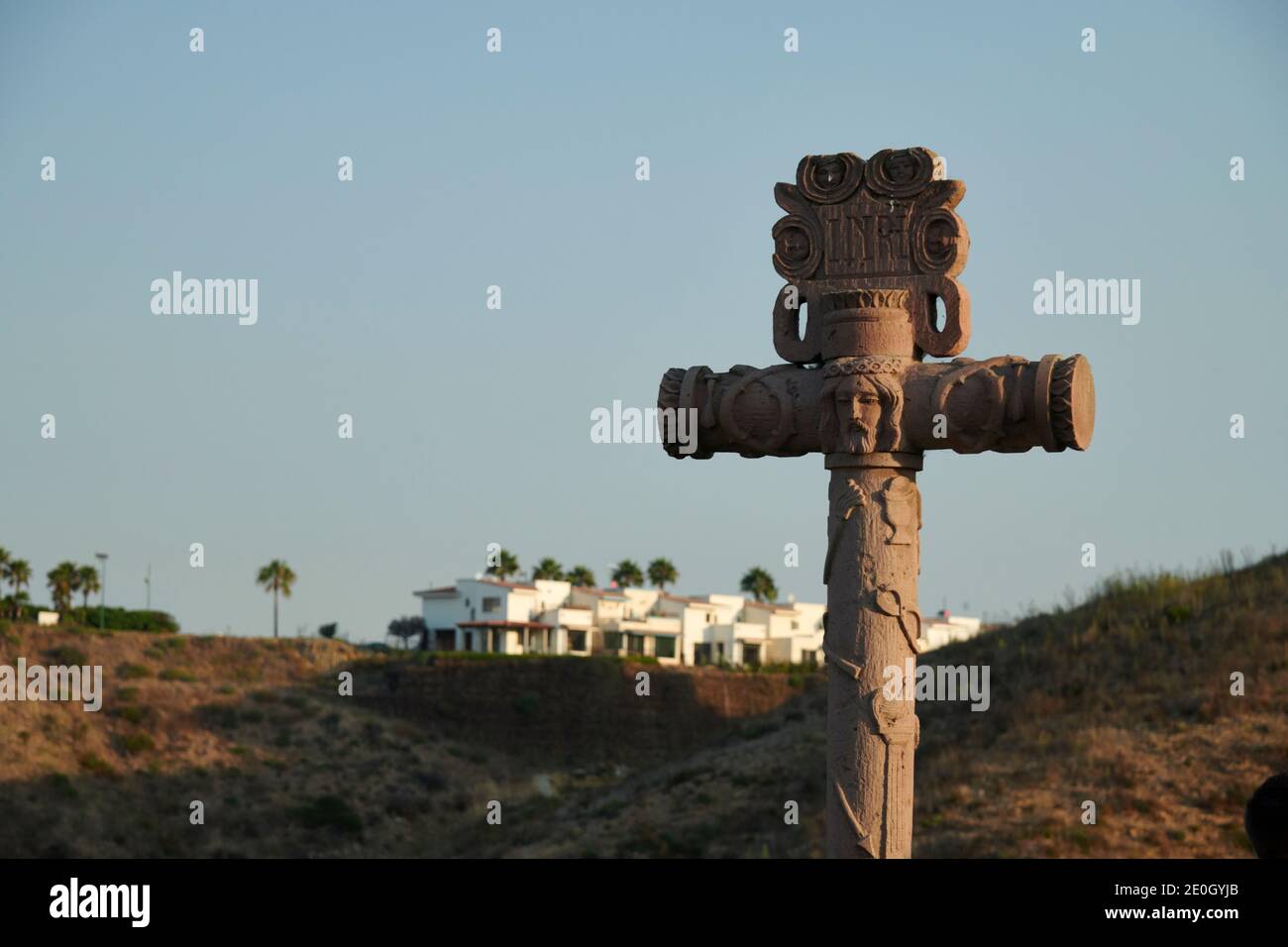 Religious cross in a village in Tijuana, Mexico at sunrise Stock Photo ...