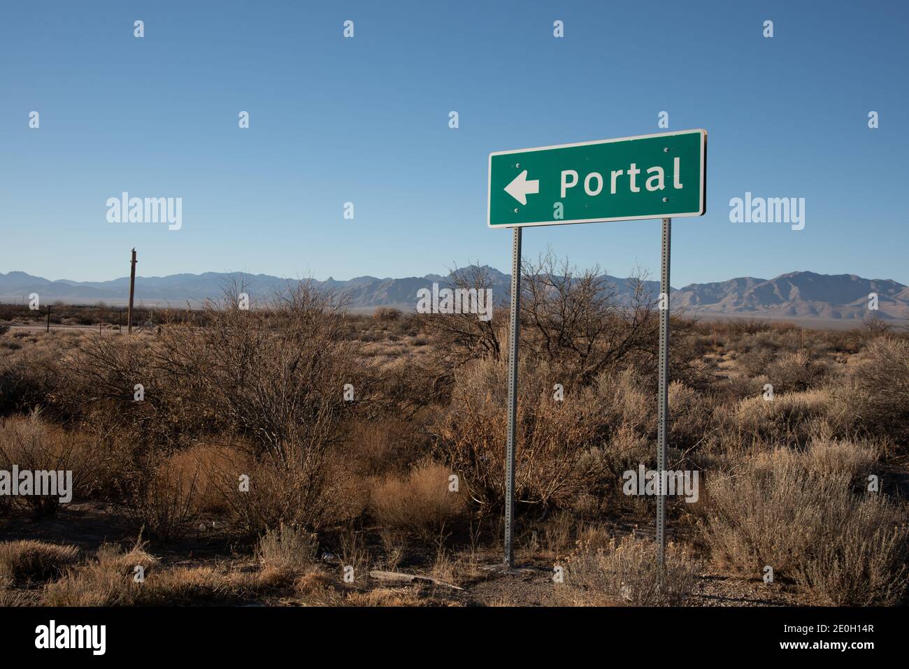 A green road sign with an arrow points to Portal, Arizona Stock Photo ...