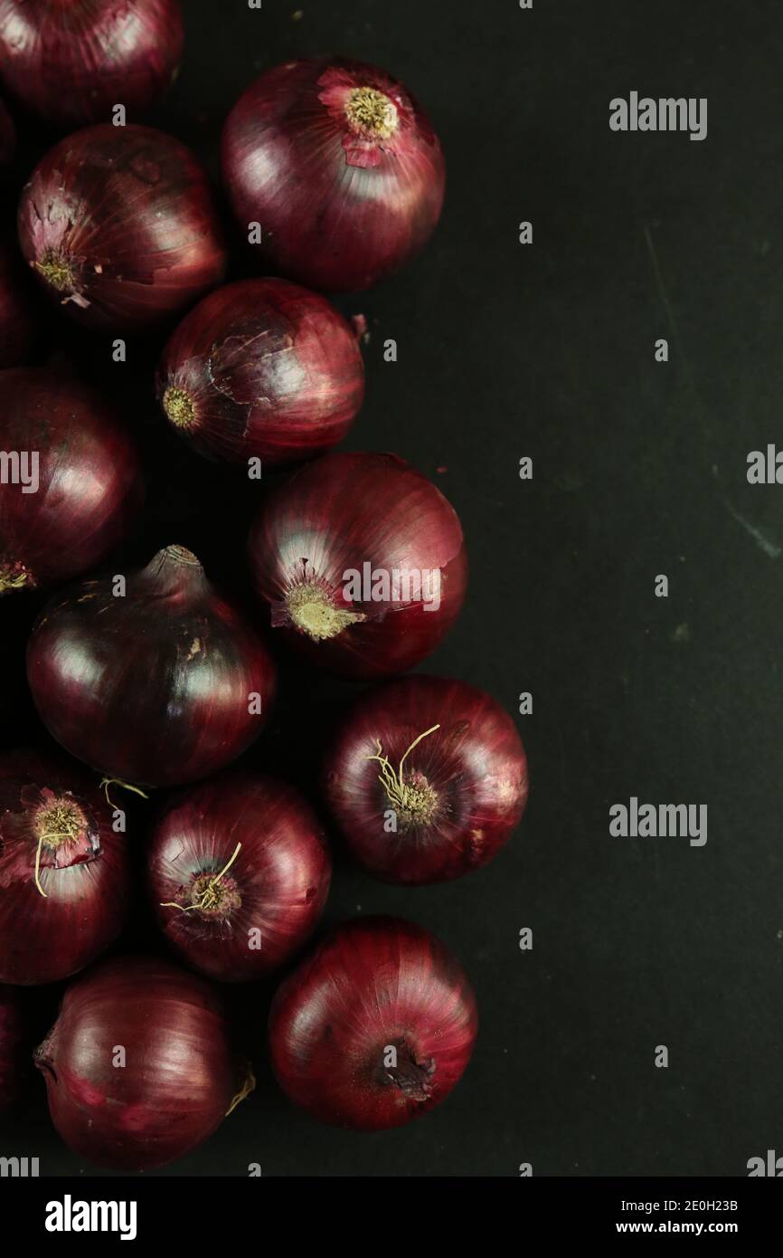 sweet red onions on background Stock Photo - Alamy