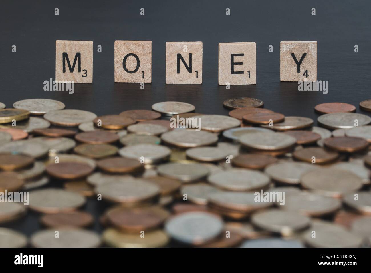 money wood tiles with coins Stock Photo - Alamy